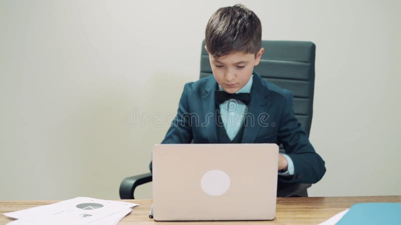 Handsome Guy Opens a Folder with Documents. There is a Laptop on the ...