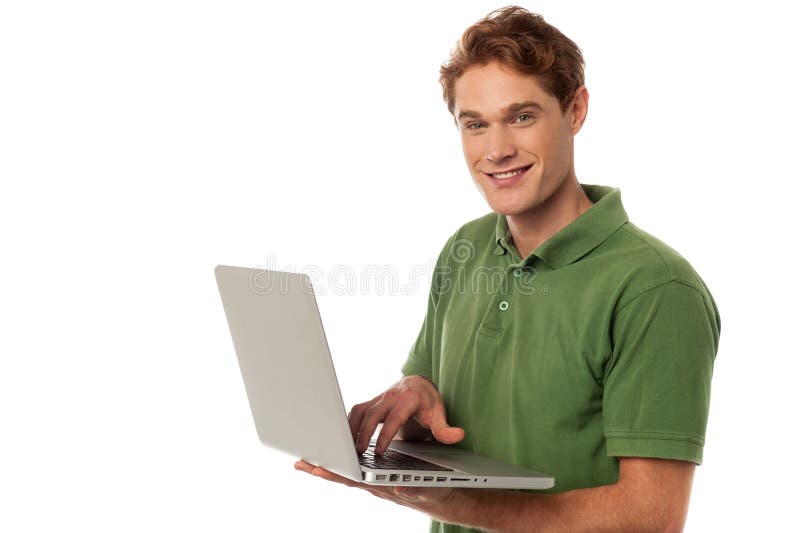 Handsome Guy Operating Laptop Stock Image - Image of friendly, cheerful ...