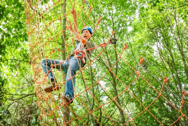 Handsome Guy in a Park on the Ropes Achieve Outdoors Stock Photo ...