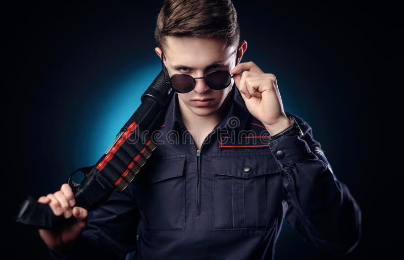 Handsome Guy in a Police Officer`s Uniform with a Gun Stock Image ...