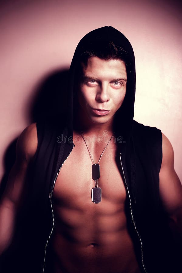 Handsome Guy Posing in Hood. Bodybuilder Stock Photo - Image of male ...