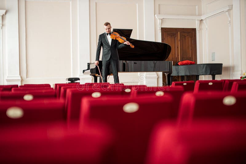 Handsome Guy Preparing for His First Performance, Practice Playing ...