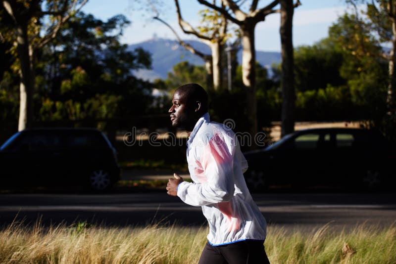 A Beautiful Dark-skinned Athlete Running on the Big Bridge Stock Image ...