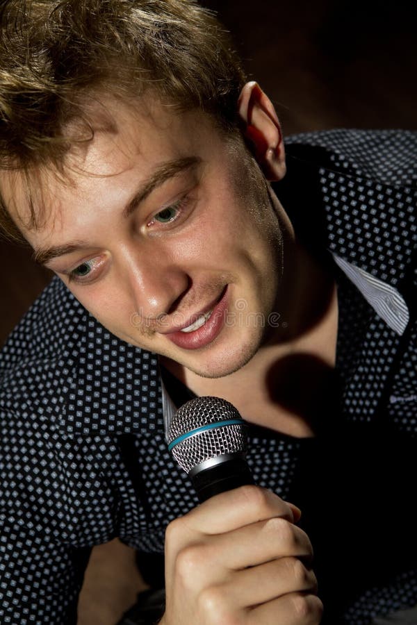 Handsome guy singing stock image. Image of microphone - 24556709