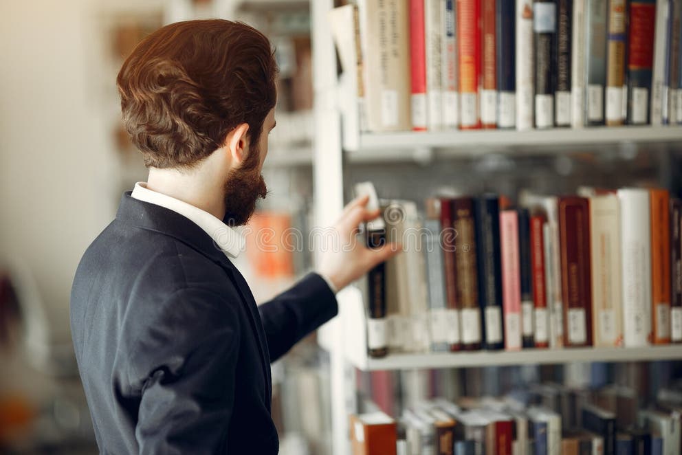 Handsome Guy Study at the Library Stock Photo - Image of bookshelf ...