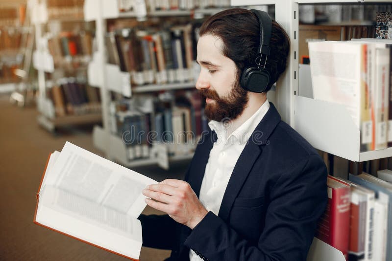 Handsome Guy Study at the Library Stock Photo - Image of holding, beard ...