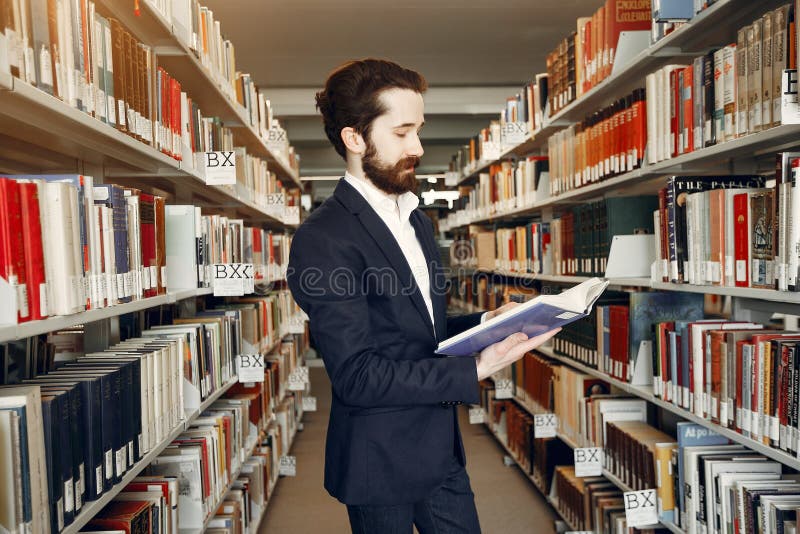 Handsome Guy Study at the Library Stock Photo - Image of bookshelf ...