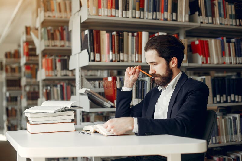 Handsome Guy Study at the Library Stock Photo - Image of paper ...