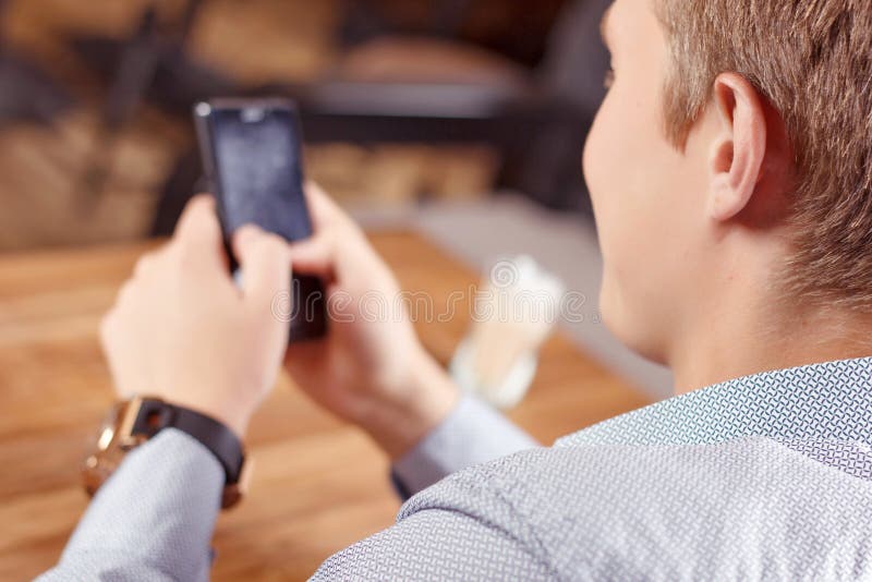 Handsome Guy Using Mobile Phone in Cafe Stock Image - Image of smile ...