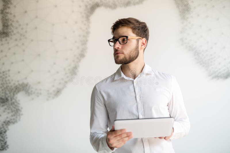 Handsome guy using tablet stock image. Image of confident - 112470827