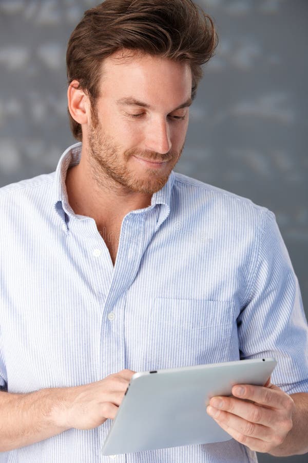 Handsome Guy Using Touchscreen Computer Stock Photo - Image of happy ...
