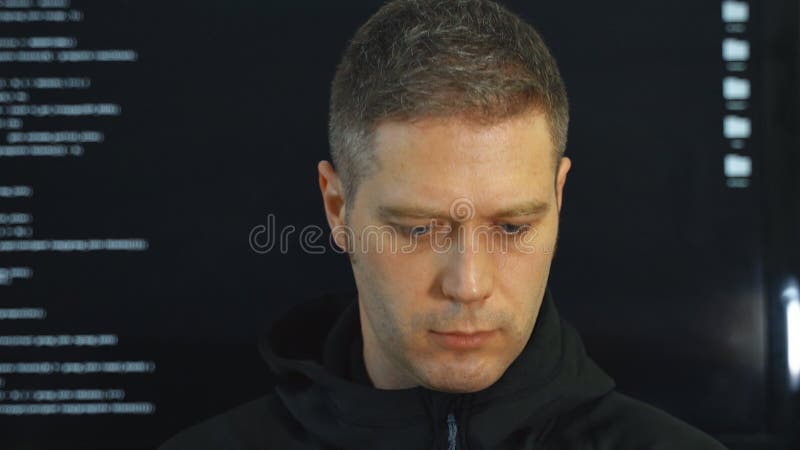 Hacker Portrait Looking at Binary Code and Trying To Find the Key Stock ...