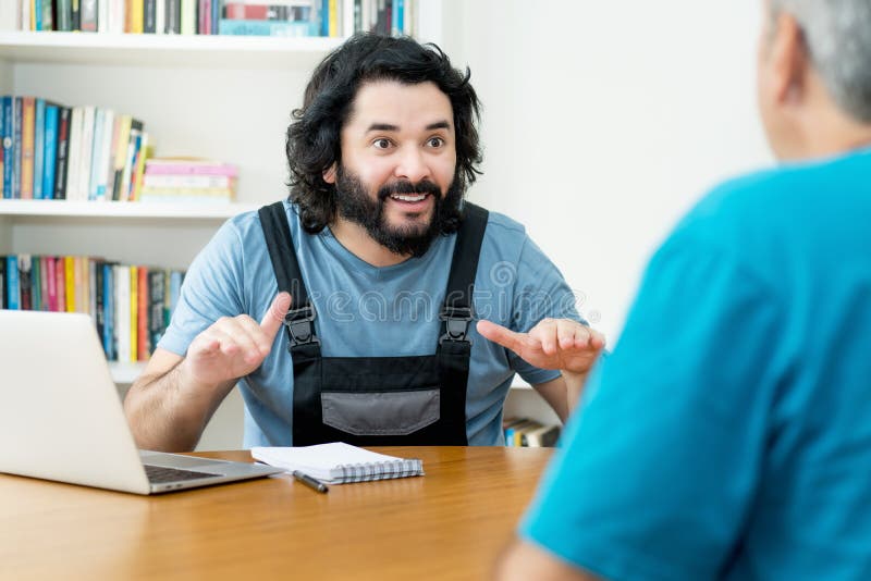 Handsome Handyman Talking about Contract and Order with Customer Stock ...