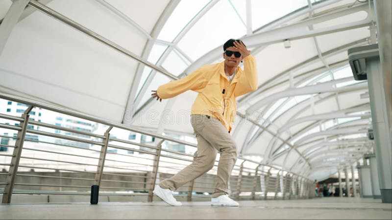 Handsome Asian Hipster Dancing while Using Head Spin at Corridor ...