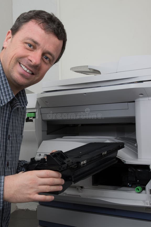Handsome and Happy Man Using a Copy Machine Stock Photo - Image of ...