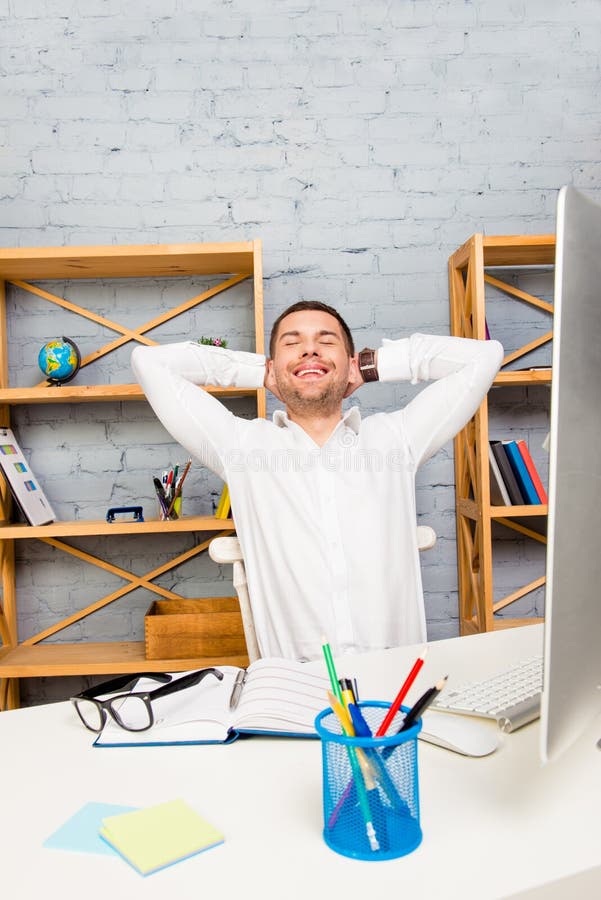 Handsome Happy Office Worker Having Break and Relaxing after Work Stock ...
