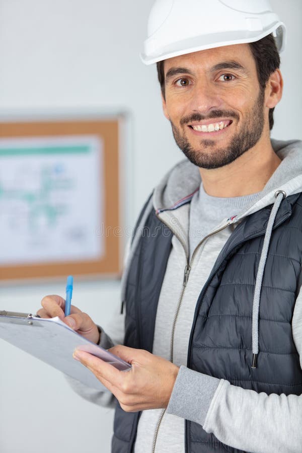 Handsome Happy Technician Using Clipboard Stock Photo - Image of ...