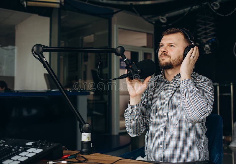 Handsome Happy Young Male Radio Host Broadcasting in Studio, Using ...