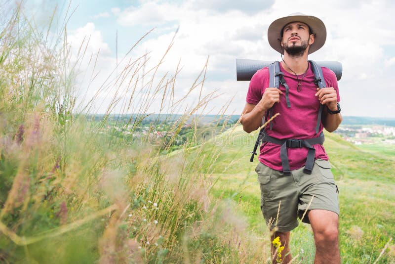 Handsome Hiker in Hat with Backpack and Tourist Mat Walking on Path ...