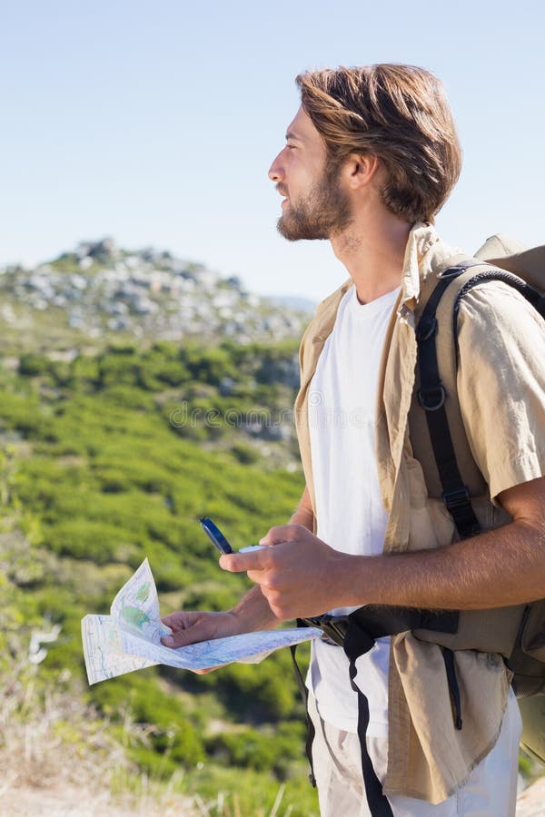 Handsome Hiker Holding Map and Compass at Mountain Summit Stock Photo ...