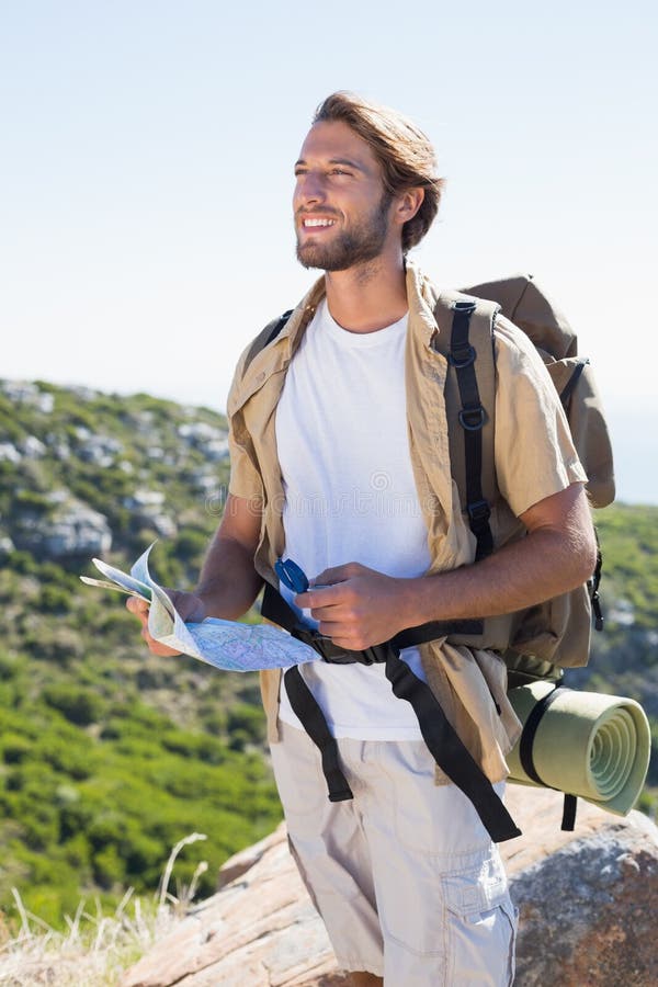 Handsome Hiker Holding Map and Compass at Mountain Summit Stock Photo ...