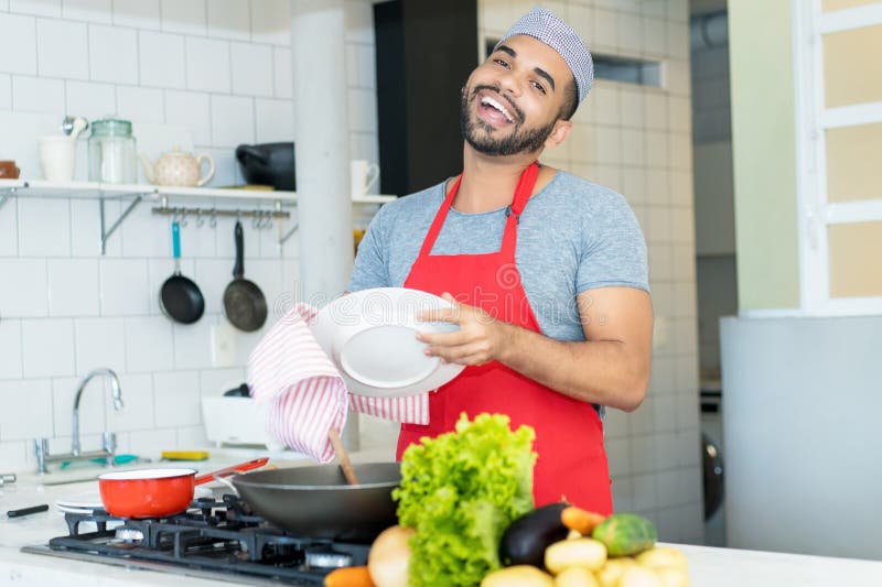 Handsome Hispanic Kitchen Assistant Cleaning Plates at Work Stock Photo ...