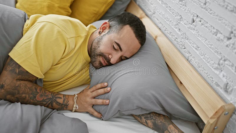 Handsome Hispanic Man with Beard and Tattoos Sleeping Peacefully in a ...