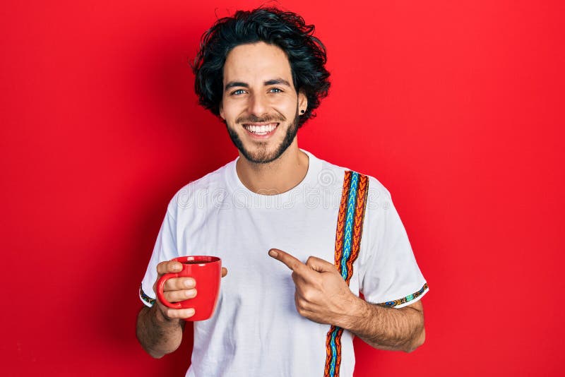 Handsome Hispanic Man Drinking a Cup Coffee Smiling Happy Pointing with ...
