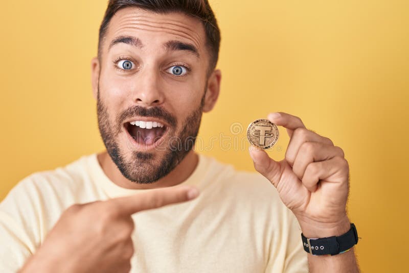 Handsome Hispanic Man Holding Tether Cryptocurrency Coin Smiling Happy ...