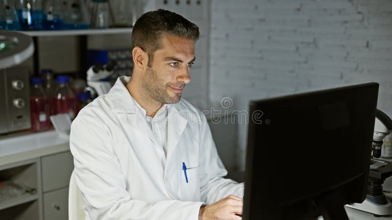 Man in a Lab Coat Using a Microscope To Examine a Sample, Suitable for ...