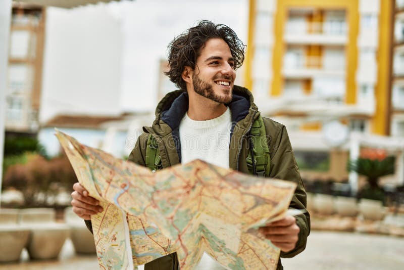 Handsome Hispanic Man Looking at Travel Map at the City Stock Image ...