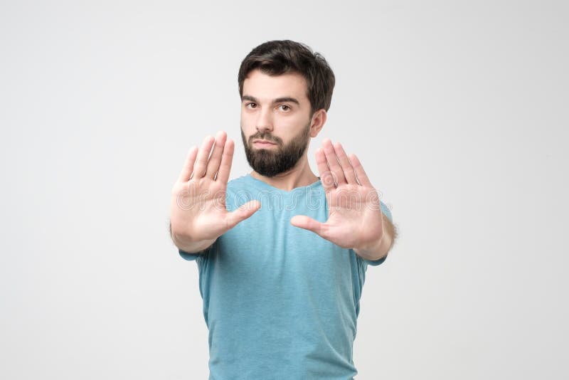 Handsome Hispanic Man Making Stop Sign Refusing To Take the Award Stock ...