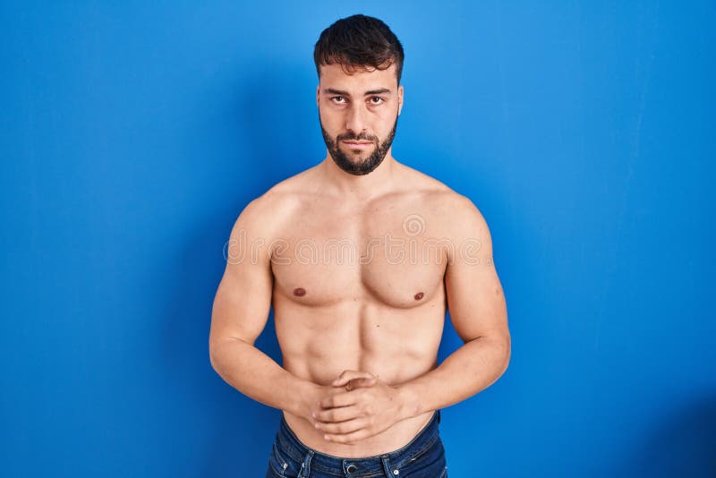 Handsome Hispanic Man Standing Shirtless Depressed and Worry for ...