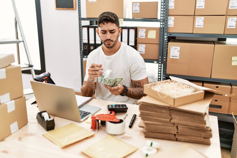 Handsome Hispanic Man Working Doing Countability at E-commerce Store ...
