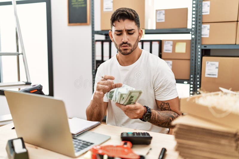 Handsome Hispanic Man Working Doing Countability at E-commerce Store ...