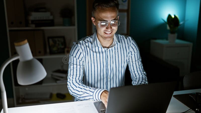 Handsome Hispanic Man Working Late on Laptop in Modern Office Interior ...