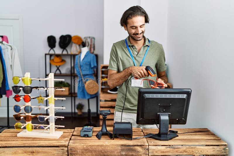 Handsome Hispanic Man Working at Shop Using Barcode Scanner at Retail ...