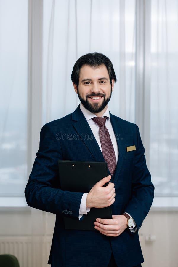 Handsome Hotel Administrator with Clipboard Looking Stock Image - Image ...