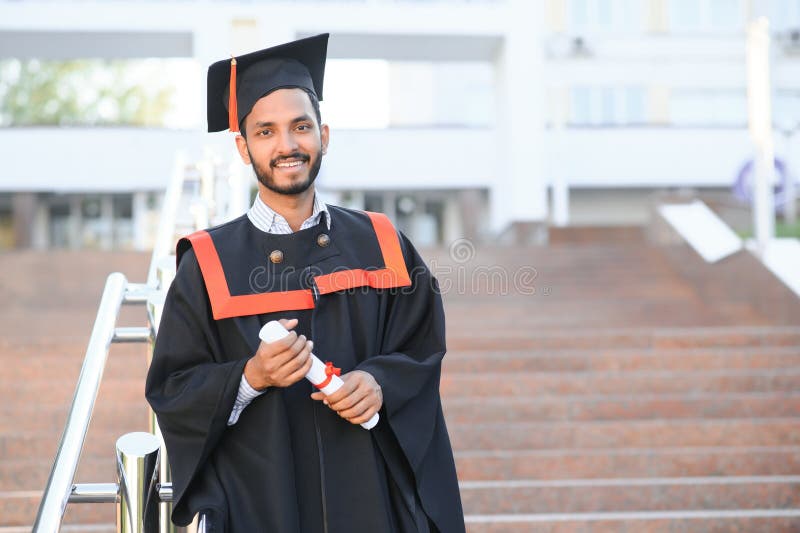 Handsome Indian Graduate in Graduation Glow with Diploma. Stock Photo ...