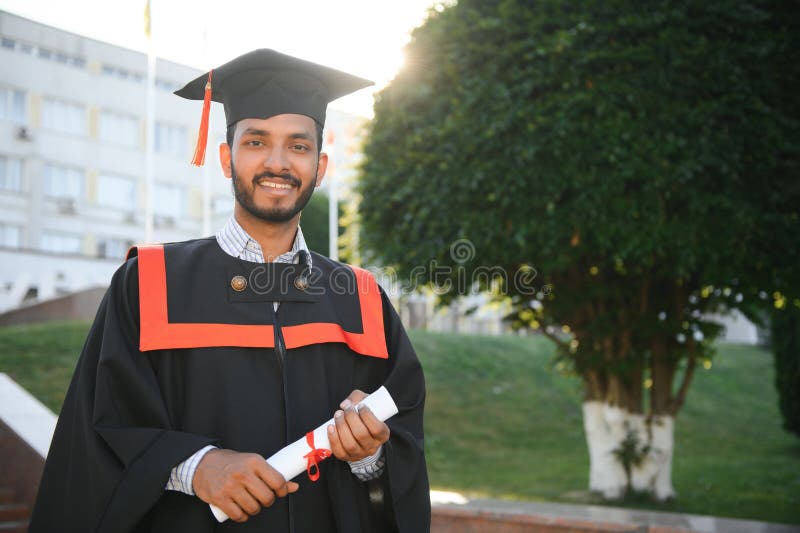 Handsome Indian Graduate in Graduation Glow with Diploma. Stock Photo ...