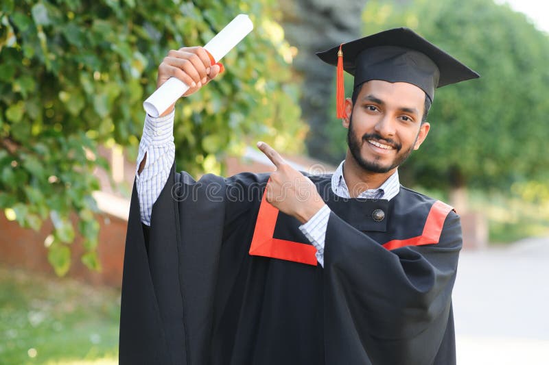 Handsome Indian Graduate in Graduation Glow with Diploma. Stock Photo ...