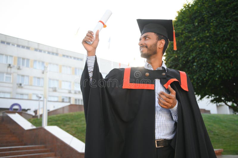 Handsome Indian Graduate in Graduation Glow with Diploma. Stock Photo ...