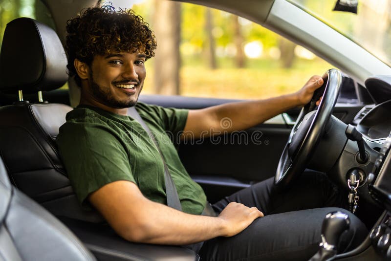 A Handsome Indian Man in a Car Outside in Countryside Stock Photo ...