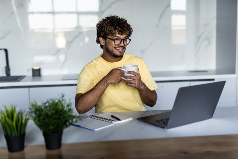 Handsome Indian Man Using a Laptop Pc in the Kitchen Stock Photo ...