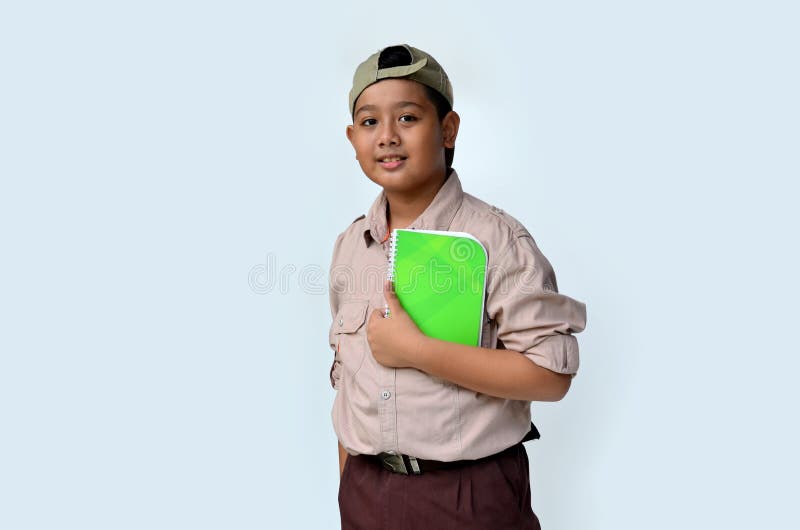 Handsome Indonesian Boy with Hold a Book Expression Stock Image - Image ...