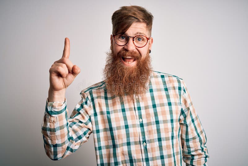Handsome Irish Redhead Man With Beard Wearing Glasses And Hipster Shirt