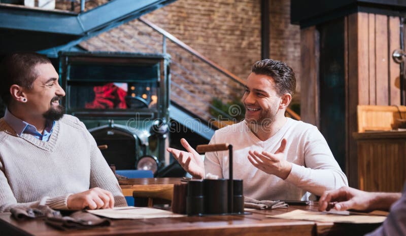 Handsome Joyful Man Explaining Something To a Friend Stock Image ...