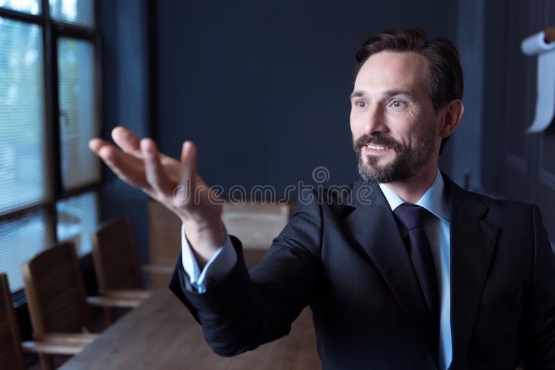 Handsome Joyful Man Looking at His Hand Stock Photo - Image of digital ...