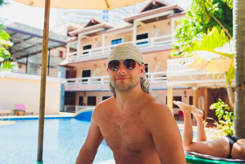 Handsome Joyful Man Lying on the Sun Bed. Stock Image - Image of ...
