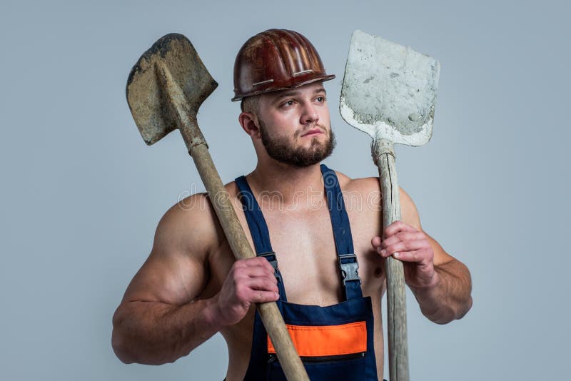 Handsome Laborerwear Work Clothes and Helmet while Working with Shovel ...